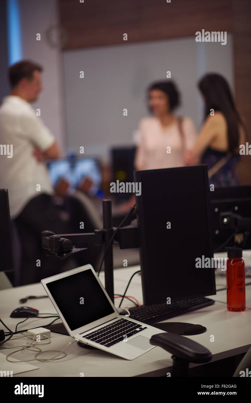 dual monitor screen and laptop computer at modern office indoors ...