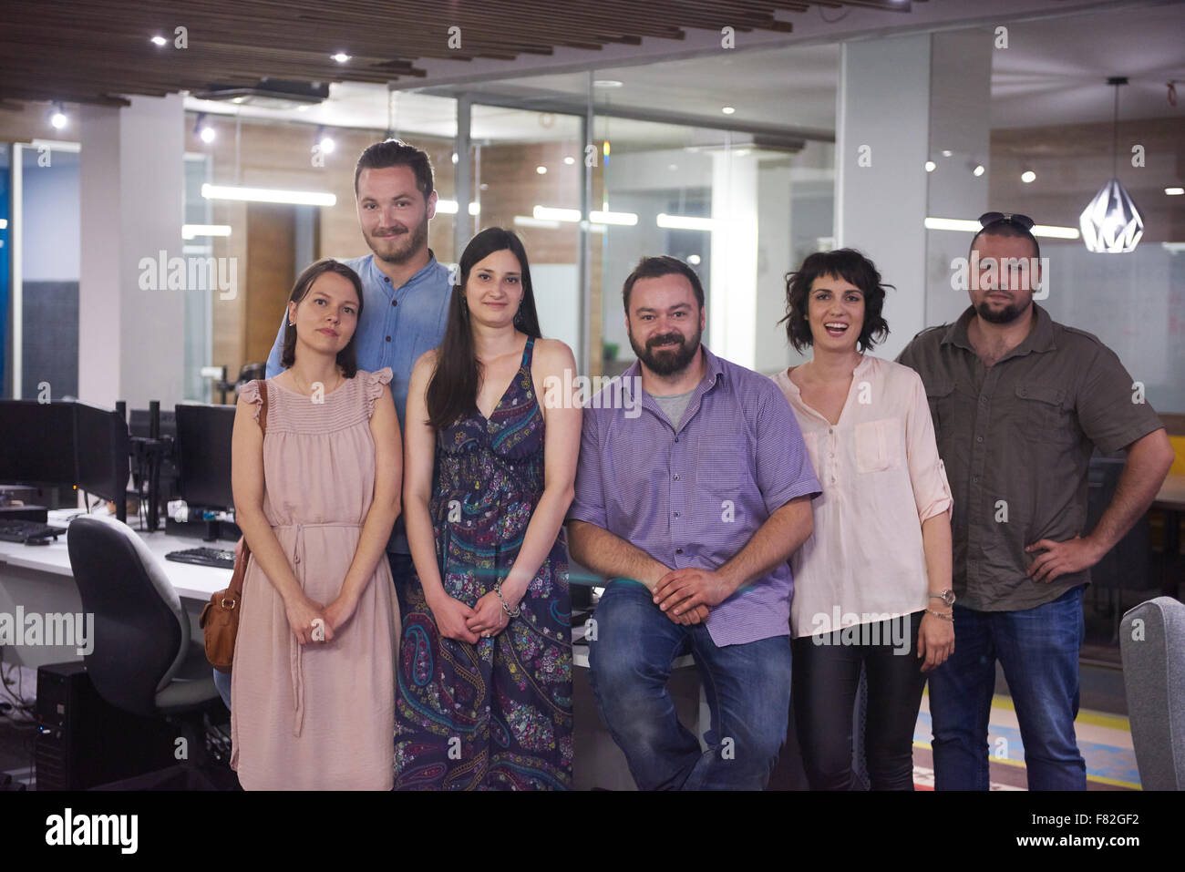 portrait of young successful startup business team at modern office ...