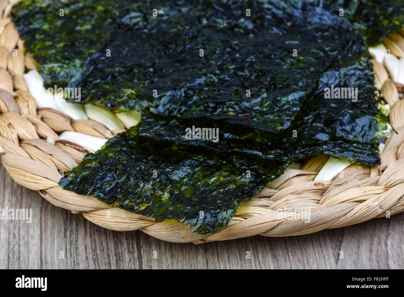 Korean traditional snack - Nori seaweed sheets on the wood background ...