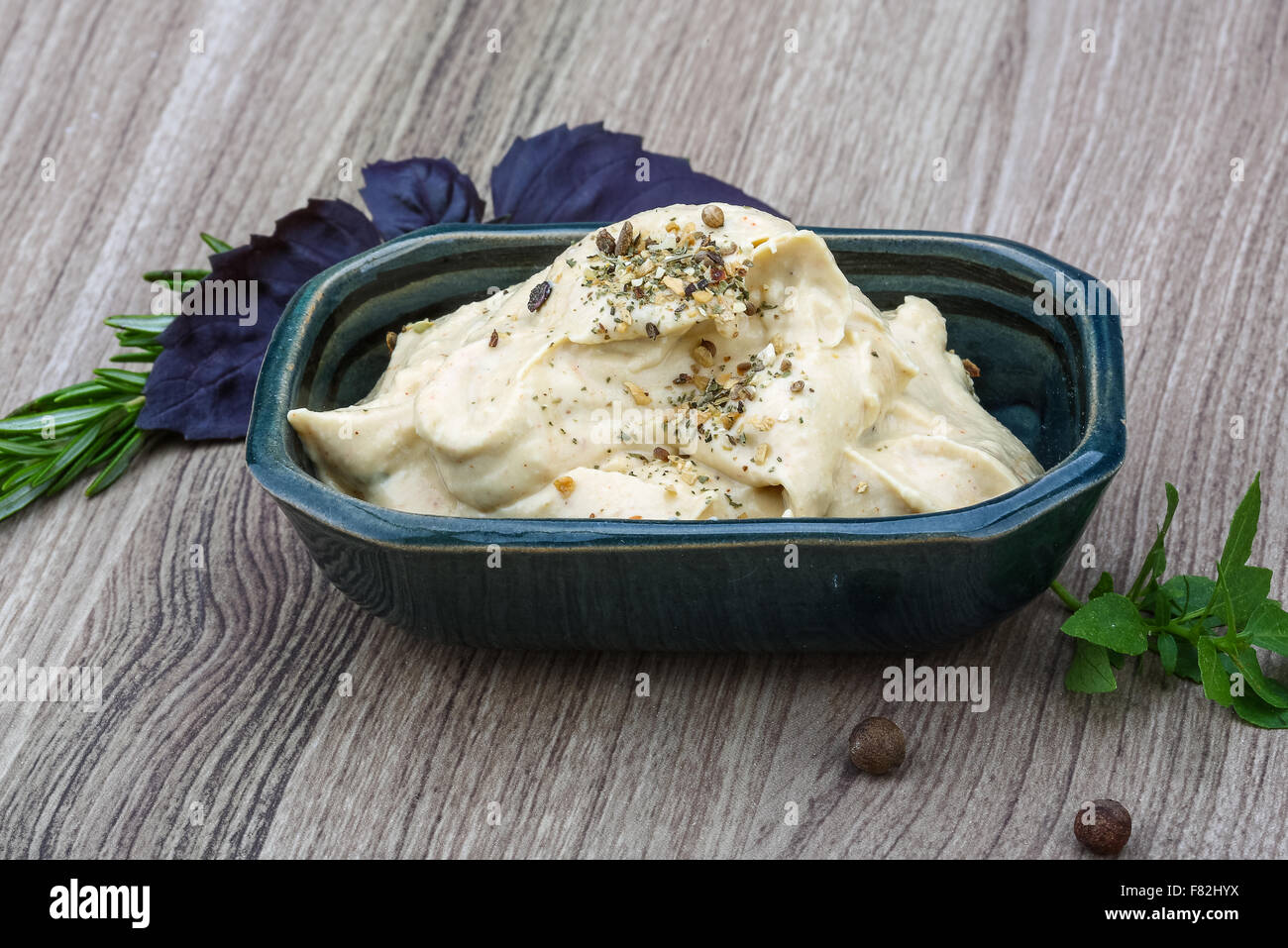 Traditional arabic cusine - hummus with herbs, olive oil and spices ...