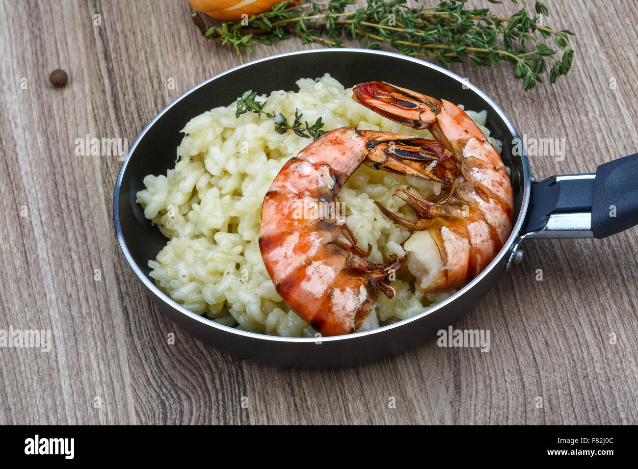 Italian trditional Risotto with tiger prawn and thyme Stock Photo - Alamy