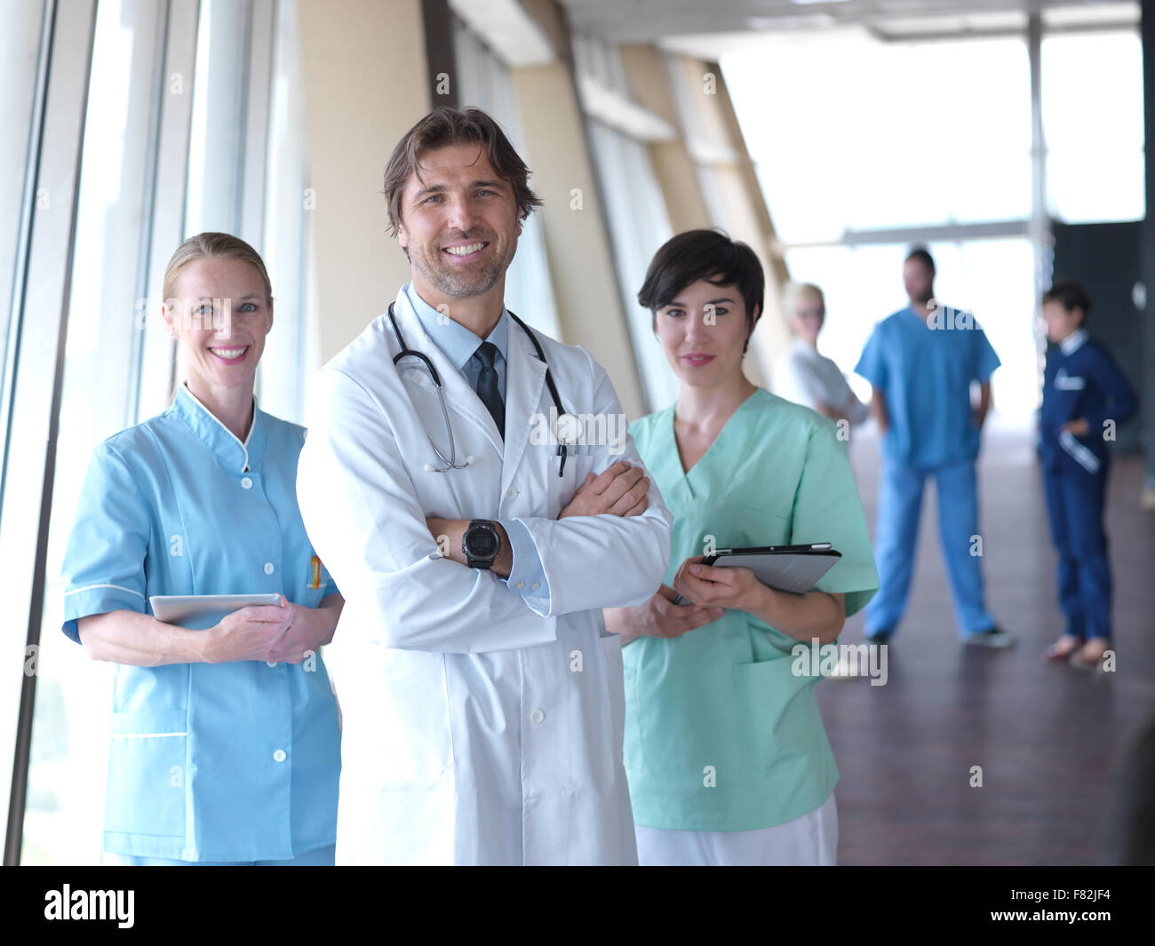 group of medical staff at hospital, doctors team standing together ...