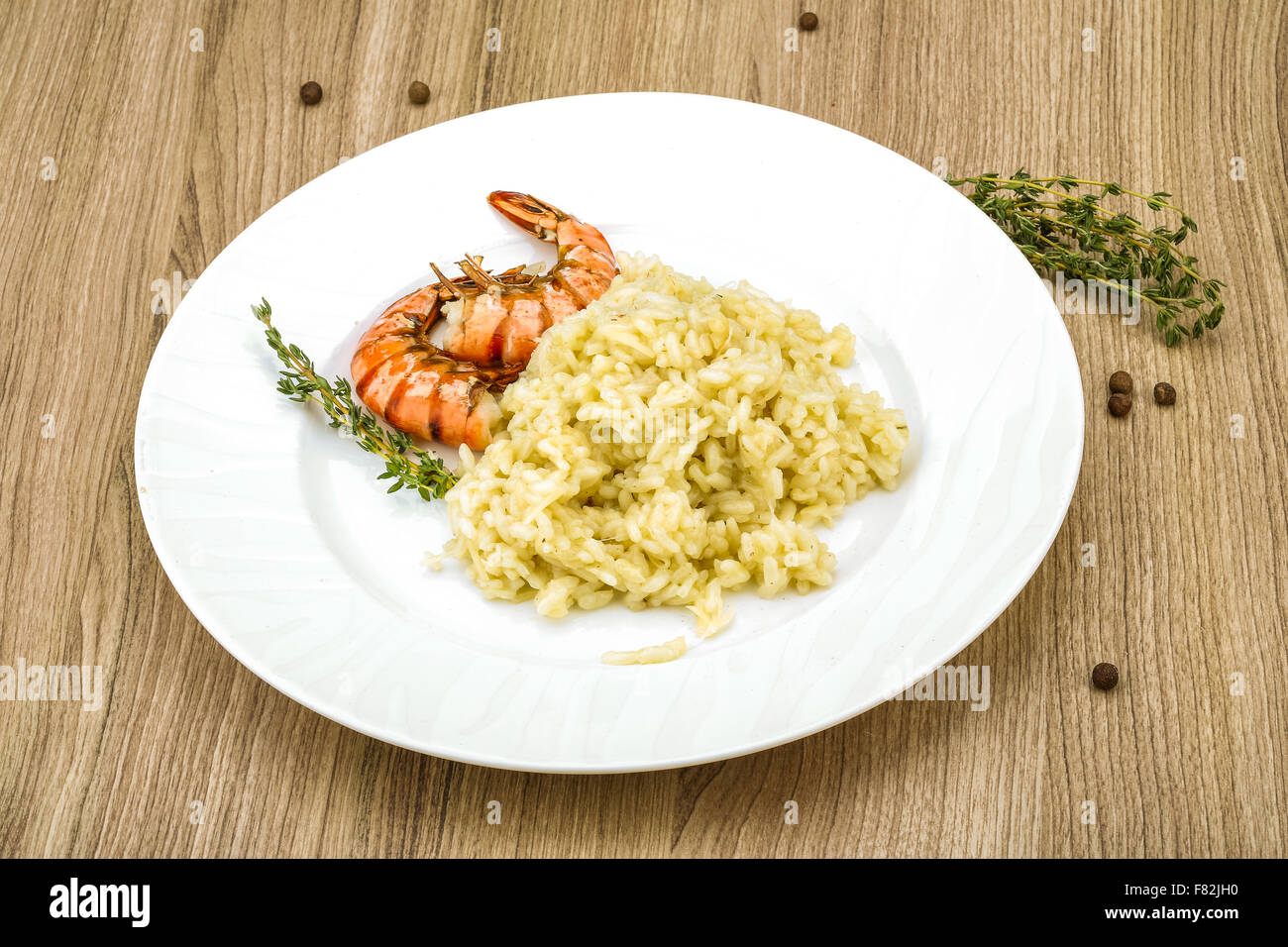 Italian trditional Risotto with tiger prawn and thyme Stock Photo - Alamy