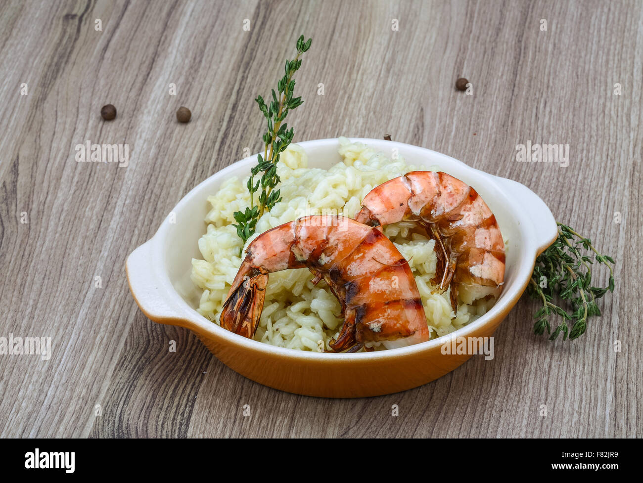 Italian trditional Risotto with tiger prawn and thyme Stock Photo - Alamy
