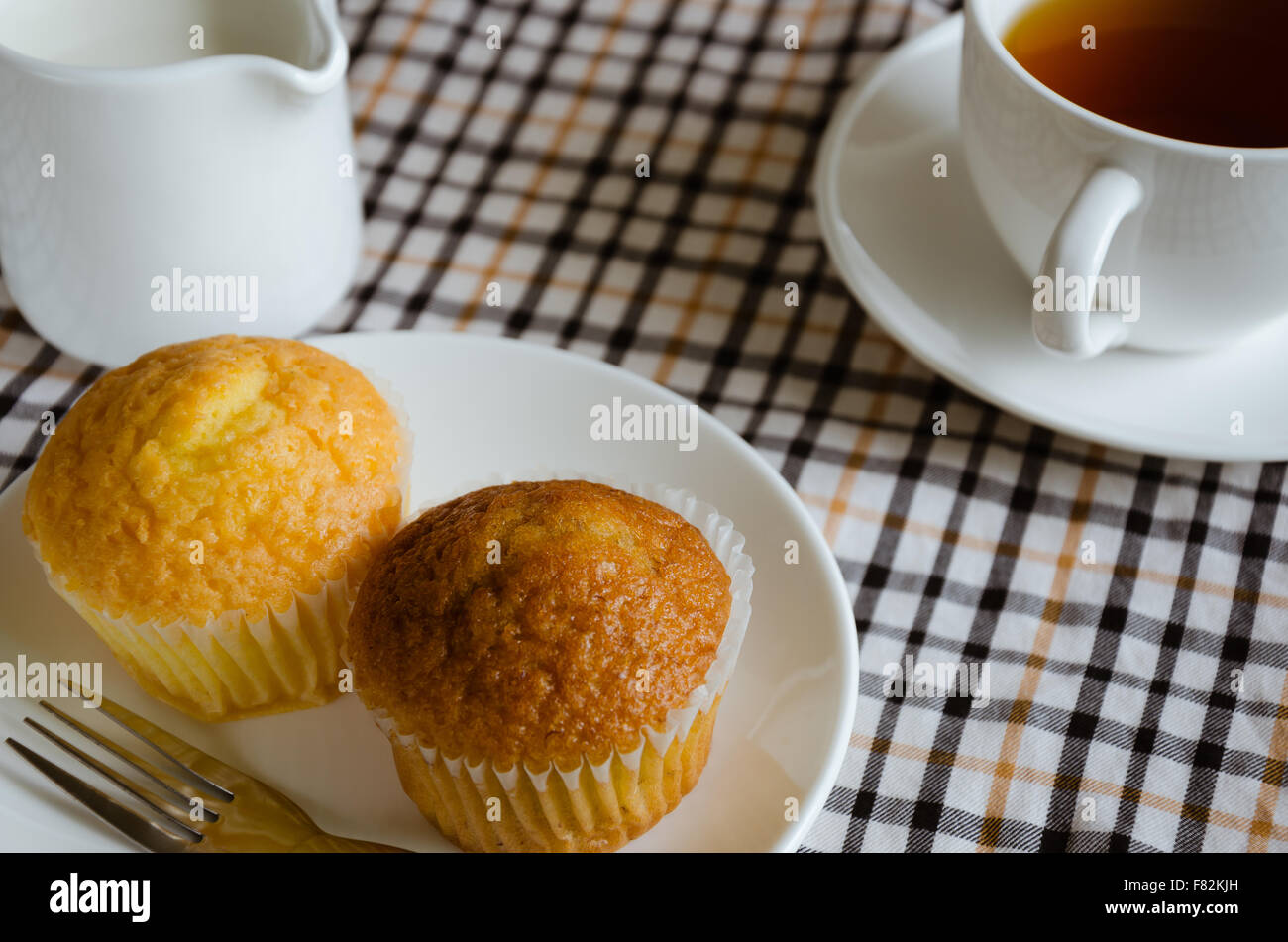 Cup Cake with Tea and Milk for Tea Break Stock Photo - Alamy