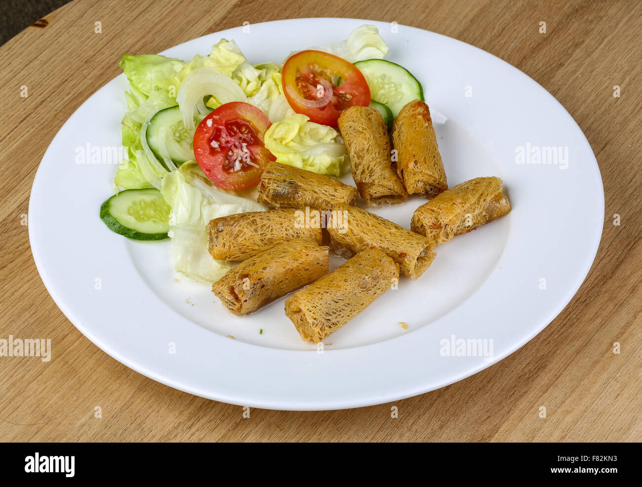 Asian traditional spring rolls on the wood background Stock Photo - Alamy
