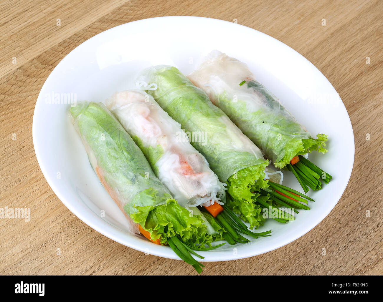 Asian traditional spring rolls on the wood background Stock Photo - Alamy