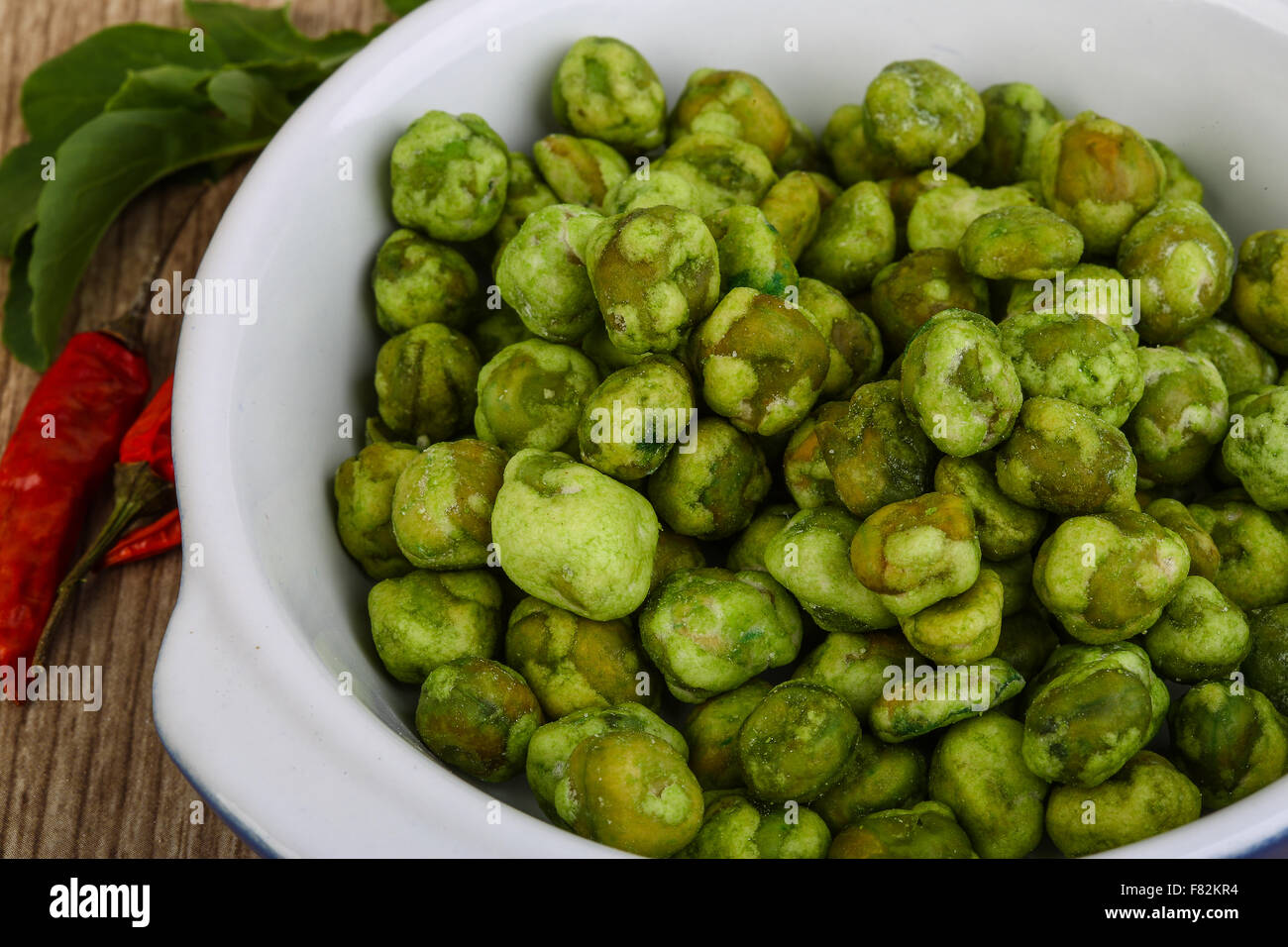 Japan traditional cuisime - Wasabi peas on the wood background Stock ...