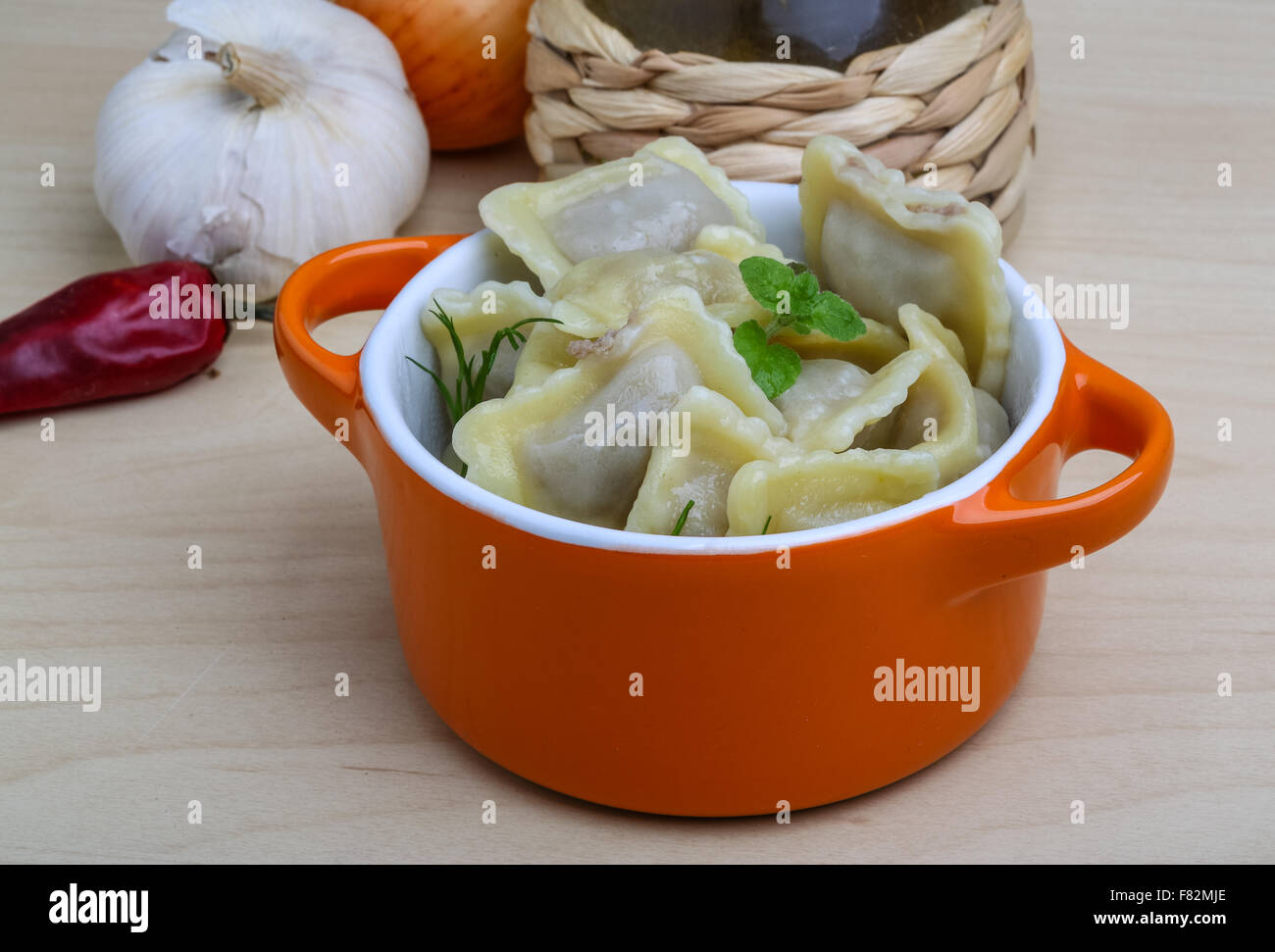Italian dumplings Ravioli with fresh herbs and spices Stock Photo - Alamy