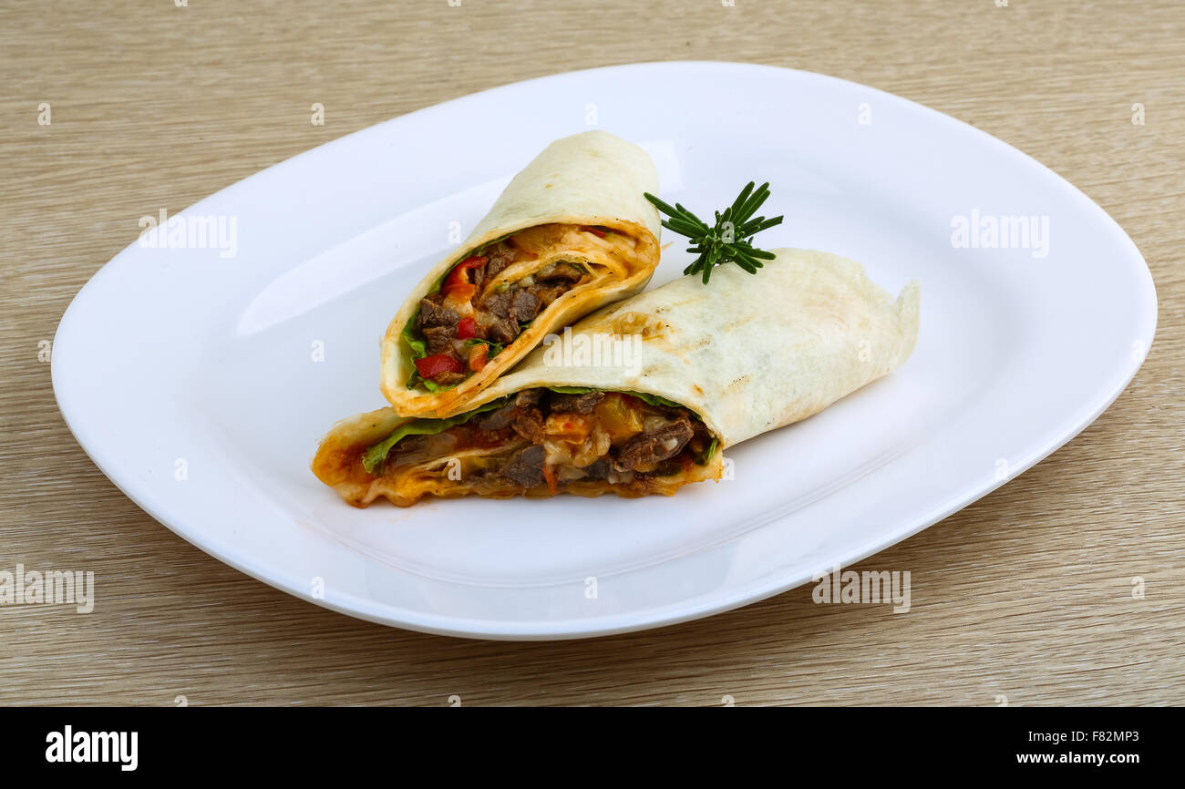 Wrap tortilla with meat, vegetables and spices Stock Photo - Alamy