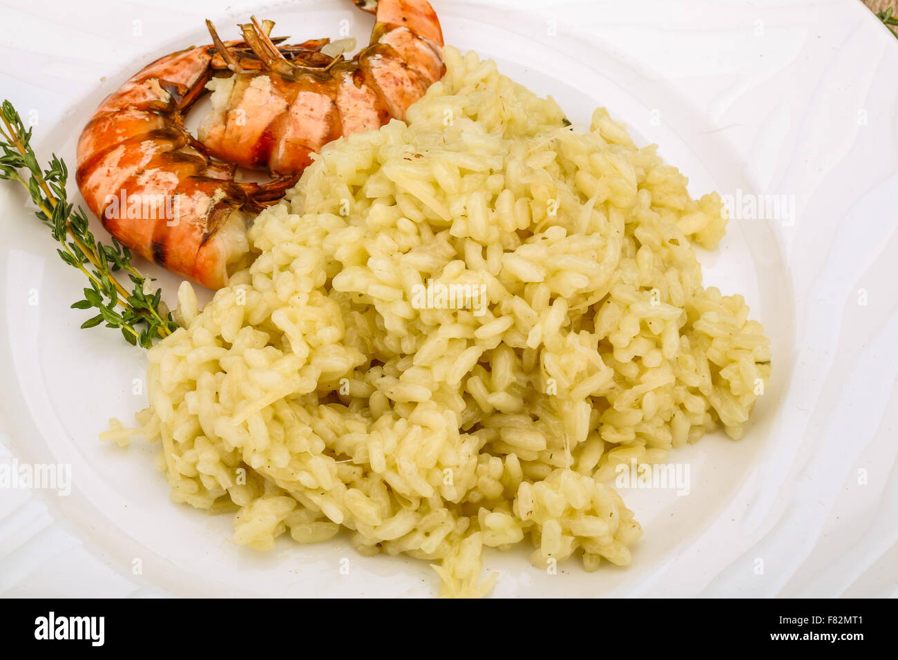 Italian trditional Risotto with tiger prawn and thyme Stock Photo - Alamy