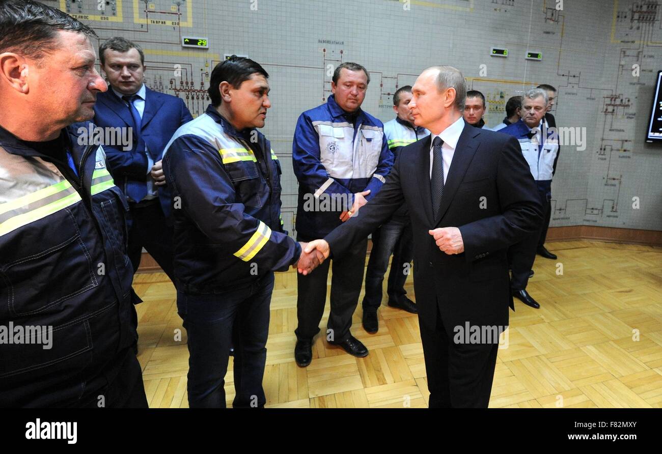 Russian President Vladimir Putin greets workers in the control room at ...