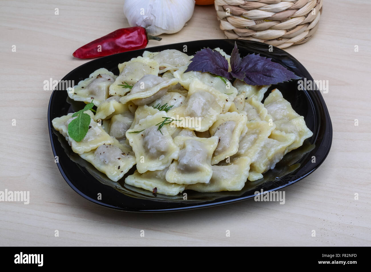 Italian dumplings Ravioli with fresh herbs and spices Stock Photo - Alamy