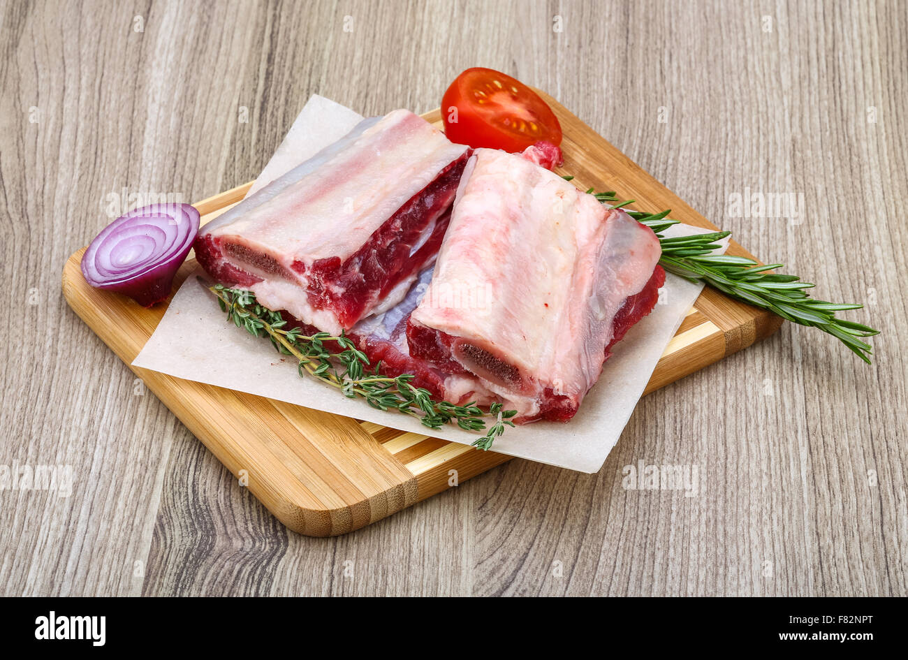 Raw beef ribs with rosemary and thyme - ready for cooking Stock Photo ...