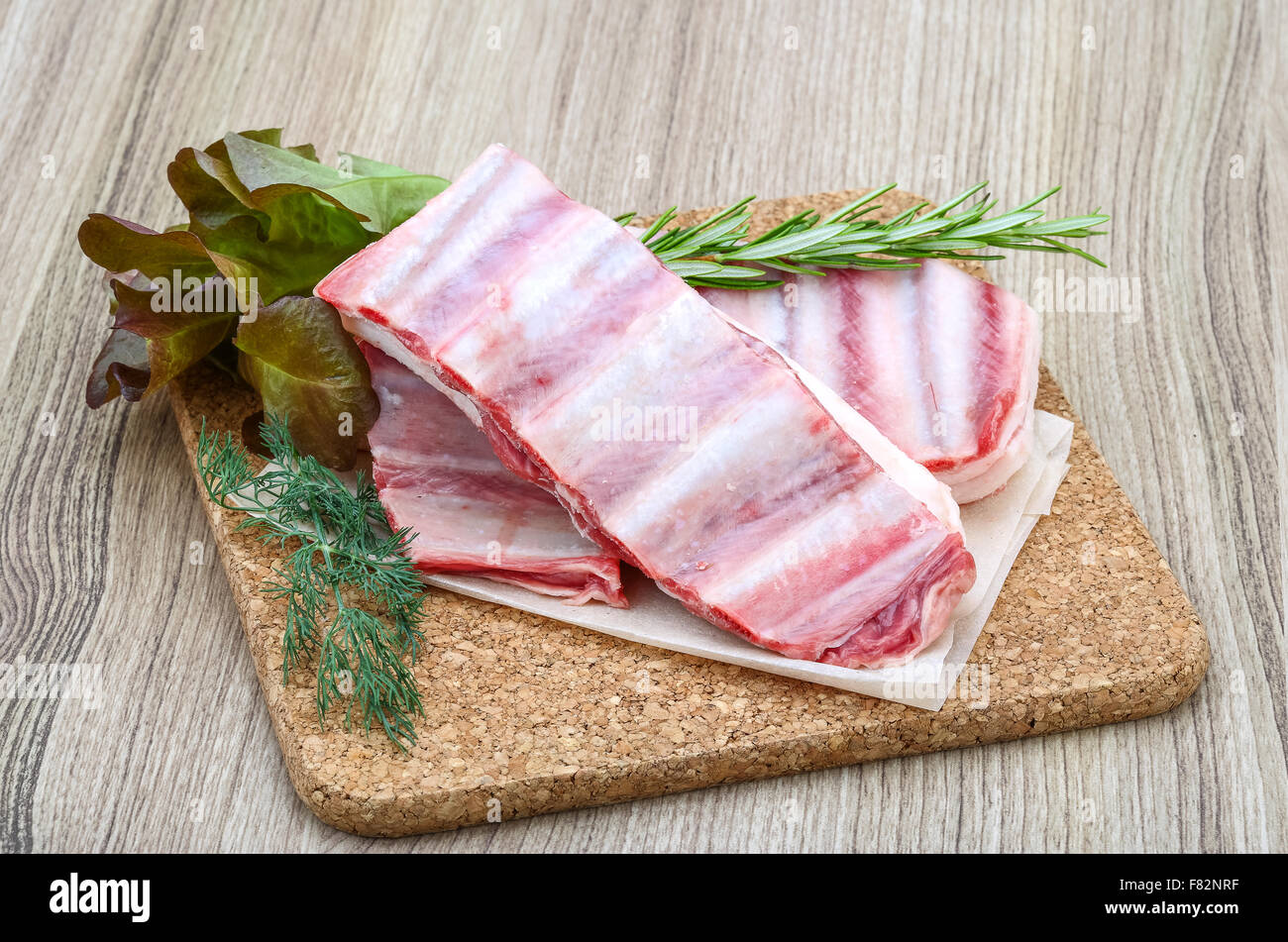 Fresh cold Raw lamb ribs with garlik and pepper - ready for cooking ...