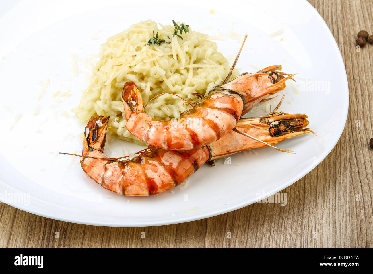 Italian trditional Risotto with tiger prawn and thyme Stock Photo - Alamy