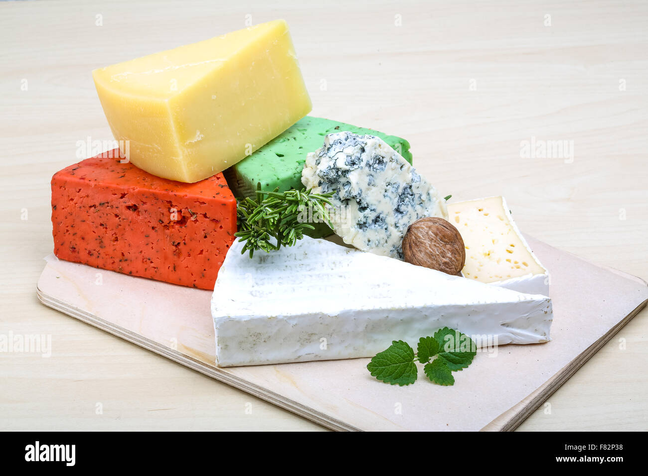 Assortment cheese with herbs on the wood background Stock Photo - Alamy