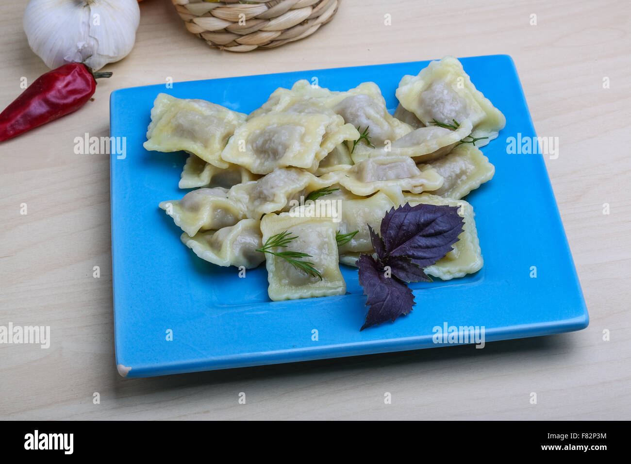 Italian dumplings Ravioli with fresh herbs and spices Stock Photo - Alamy