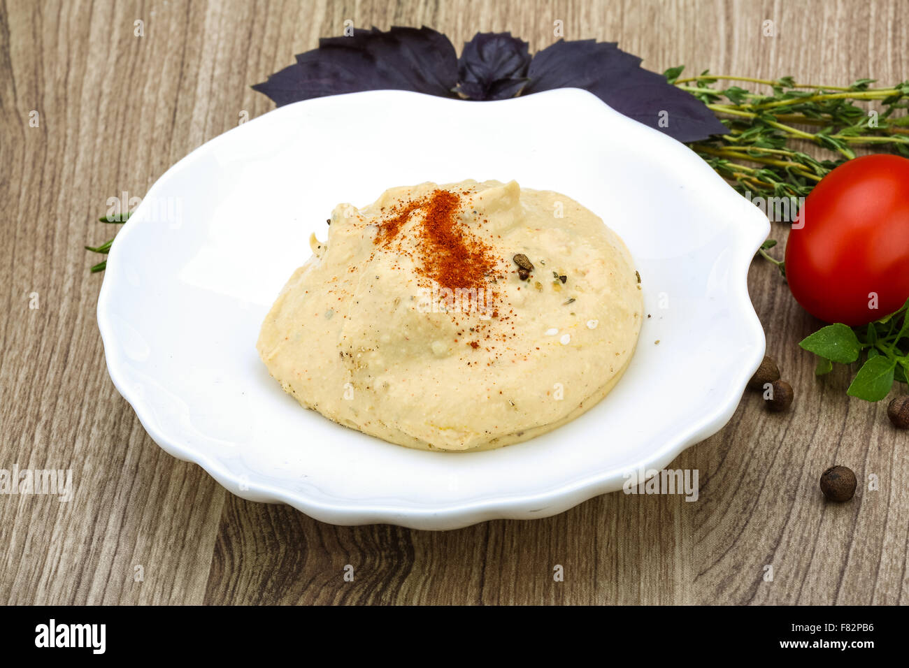 Arabic traditional cusine - hummus with olive oil, herbs and spices ...