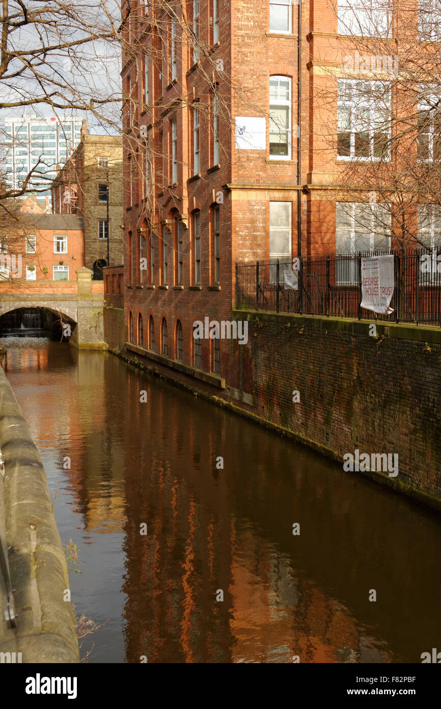 Brick built canal in Manchester with reflections Stock Photo - Alamy