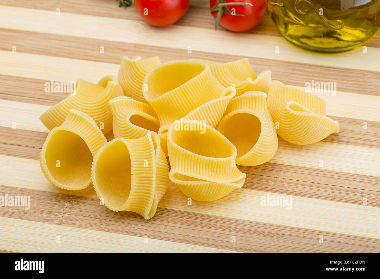 Pipe rigate pasta on the wood background Stock Photo - Alamy