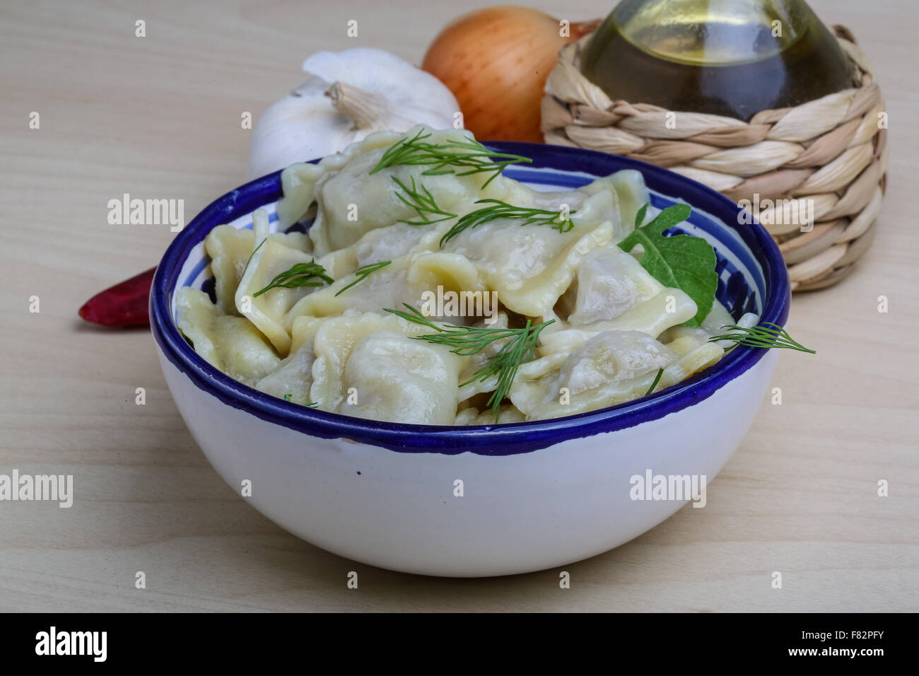 Italian dumplings Ravioli with fresh herbs and spices Stock Photo - Alamy