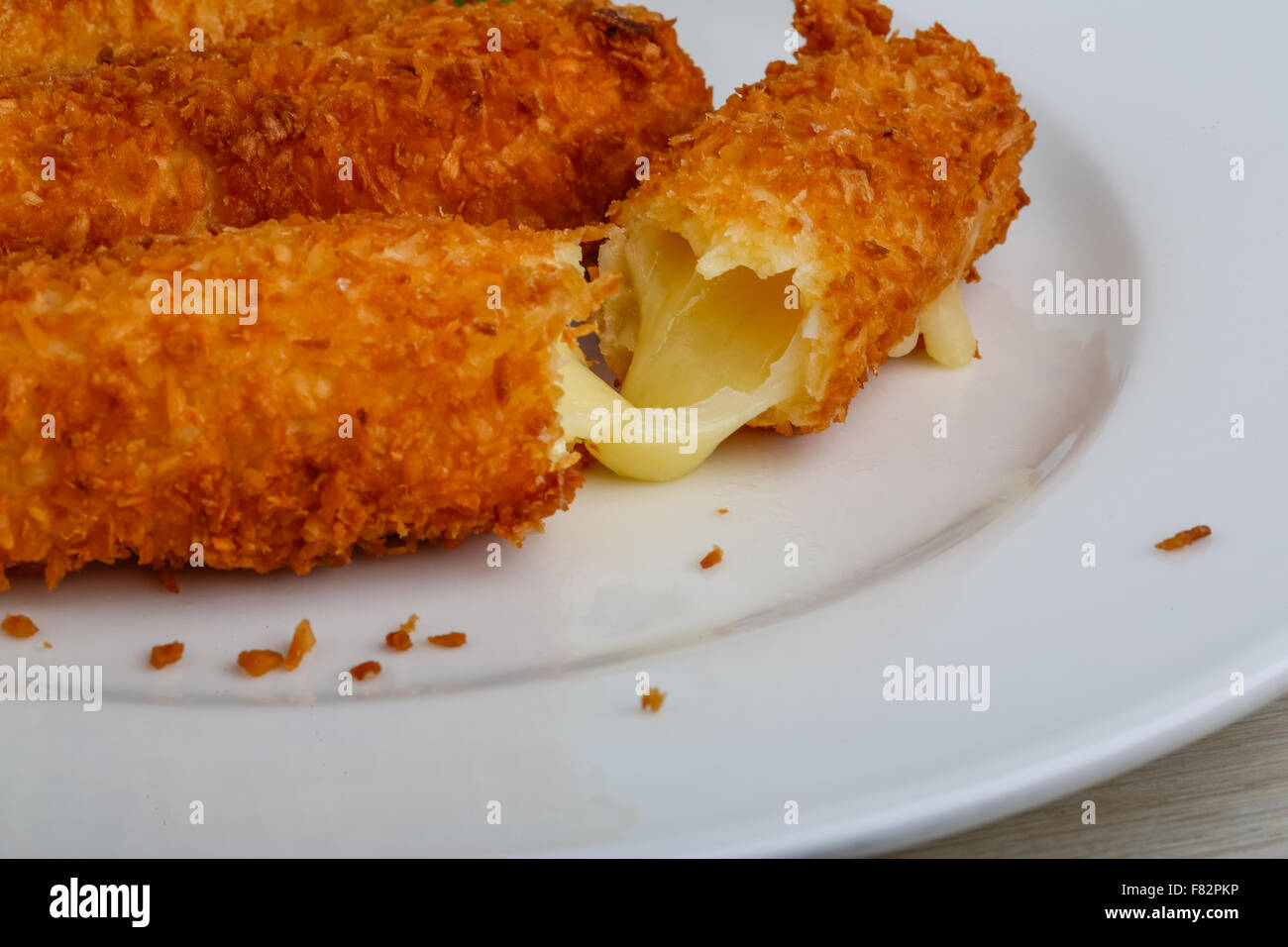 Fried cheese sticks in pan with dill Stock Photo - Alamy