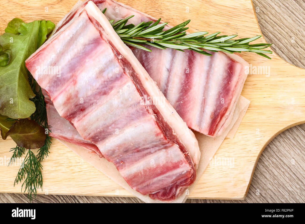 Fresh cold Raw lamb ribs with garlik and pepper - ready for cooking ...