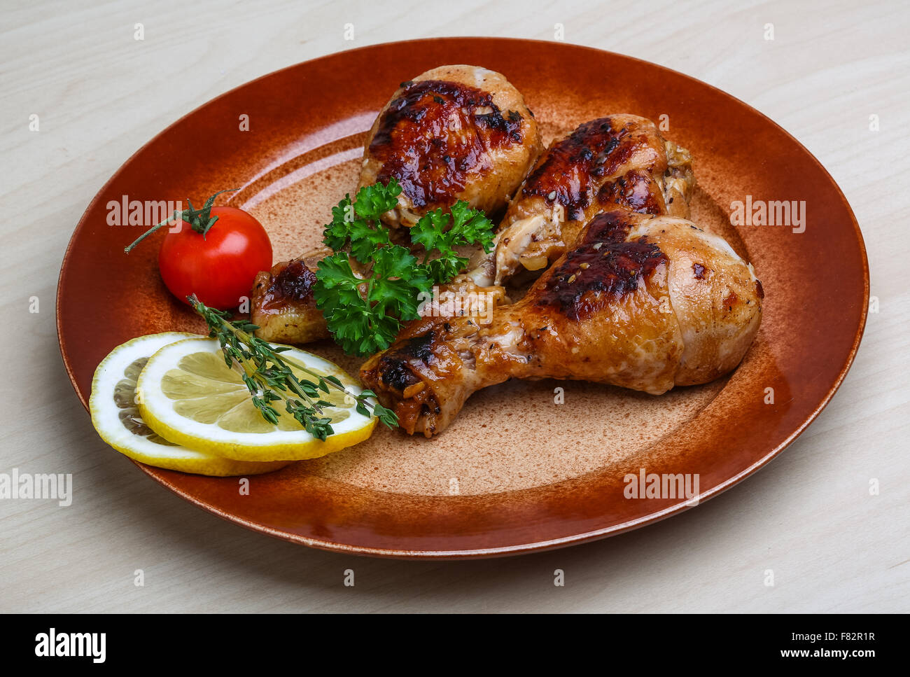 Roasted chicken legs in teriyaki sause with thyme Stock Photo - Alamy