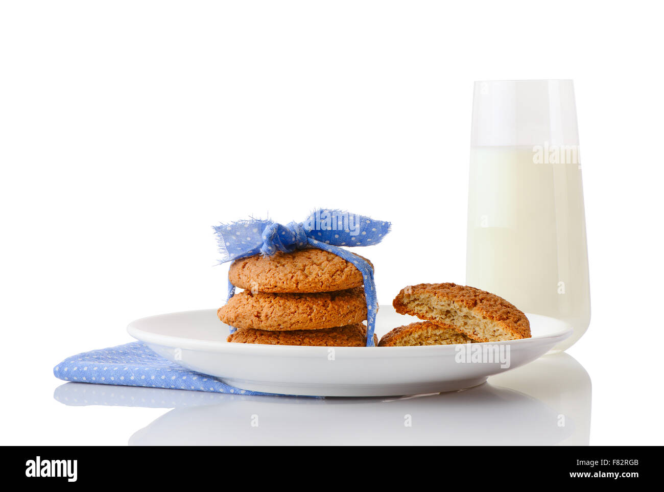 Stack of three homemade oatmeal cookies tied with blue ribbon and ...