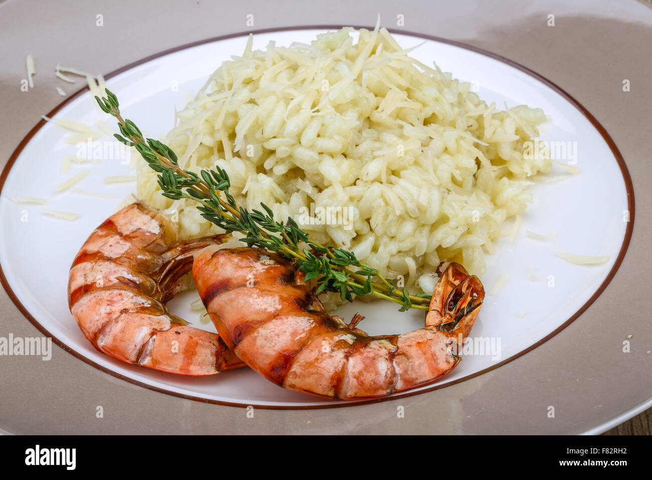 Italian trditional Risotto with tiger prawn and thyme Stock Photo - Alamy