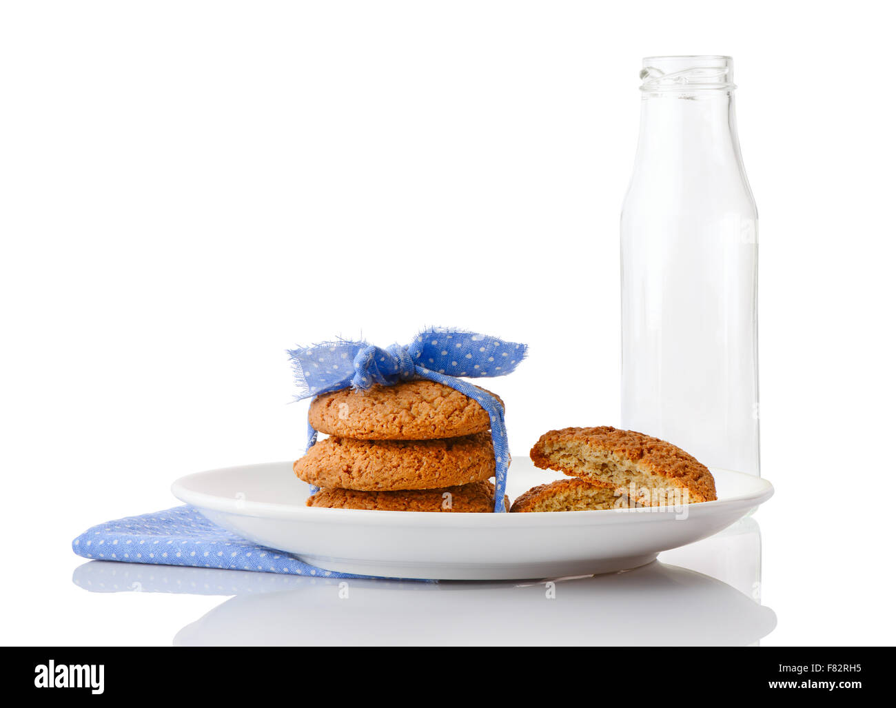 Stack of three homemade oatmeal cookies tied with blue ribbon and ...