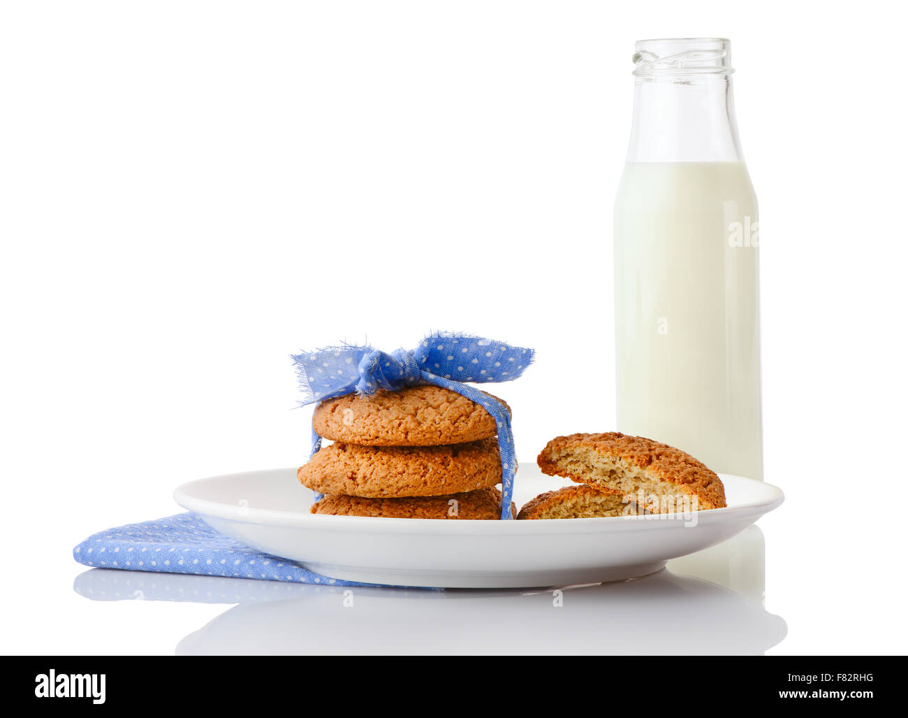 Stack of three homemade oatmeal cookies tied with blue ribbon and ...