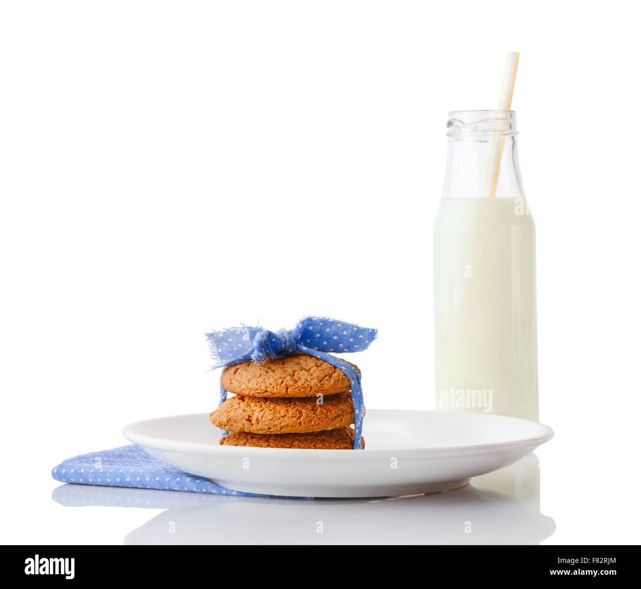 Stack of three homemade oatmeal cookies tied with blue ribbon in white ...