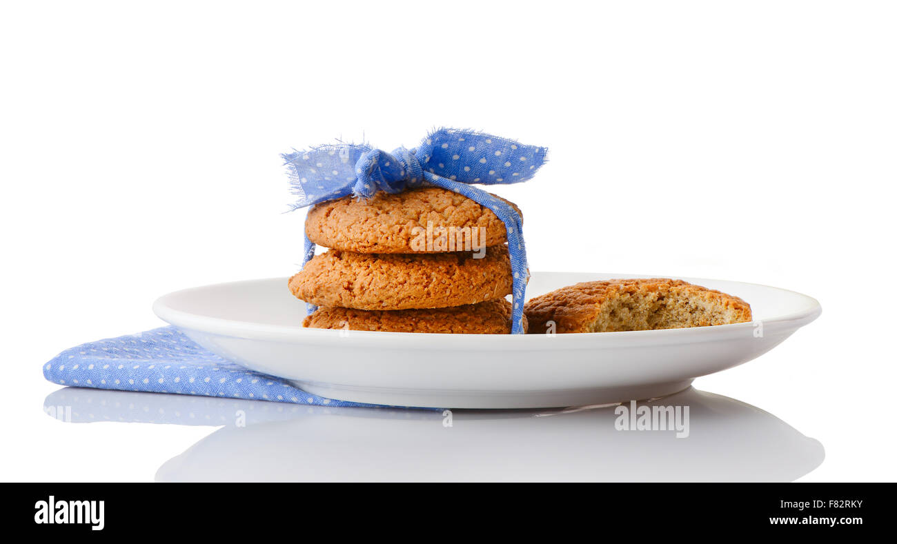 Stack of three homemade oatmeal cookies tied with blue ribbon in small ...