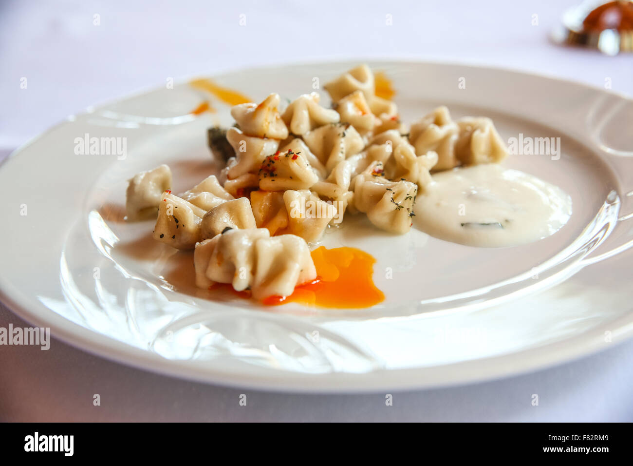 Turkish dumplings - manti with yoghurt sauce Stock Photo - Alamy