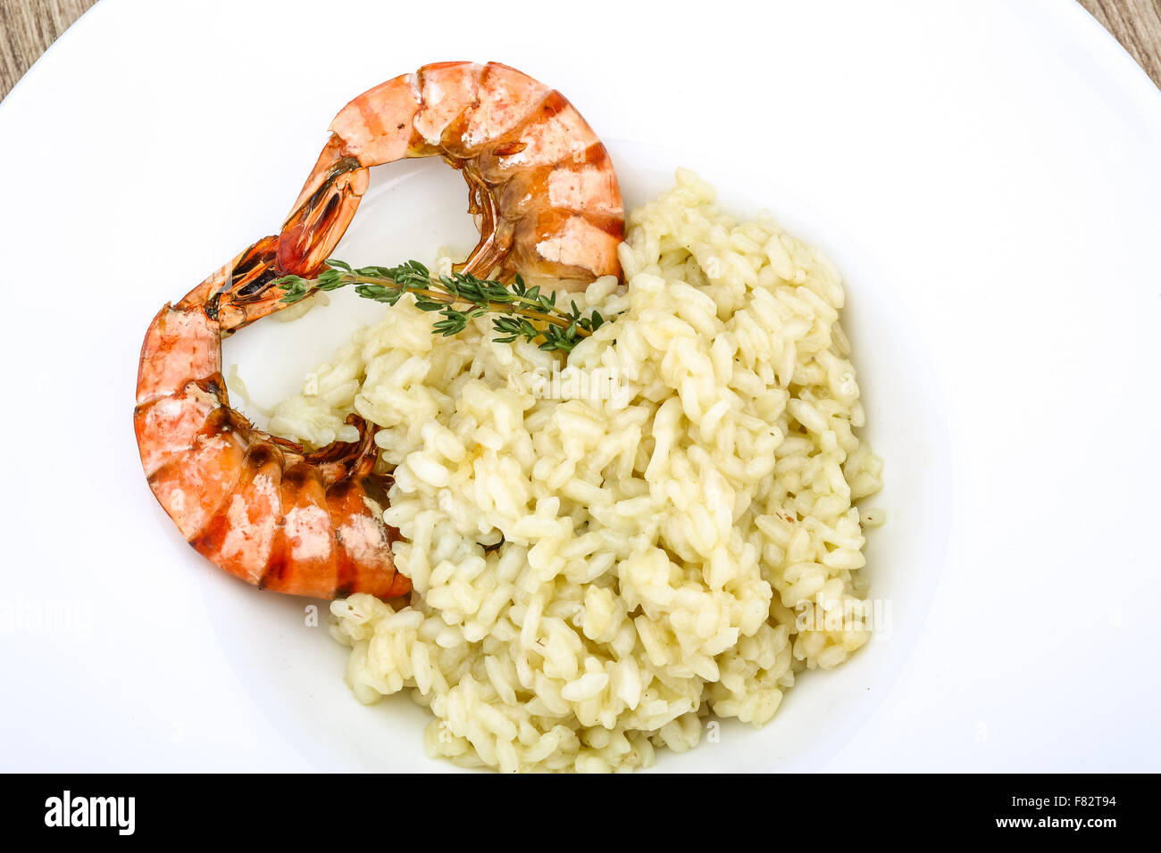 Italian trditional Risotto with tiger prawn and thyme Stock Photo - Alamy
