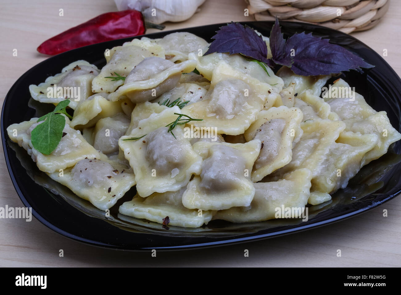 Italian dumplings Ravioli with fresh herbs and spices Stock Photo - Alamy