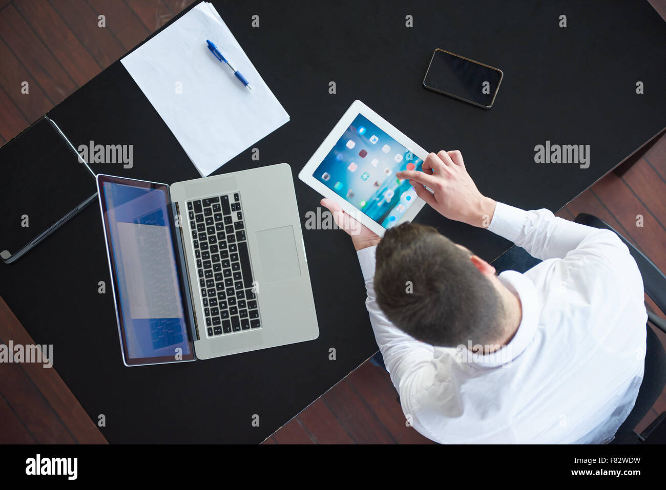 top view of happy young business man, work tablet and laptop and relax ...