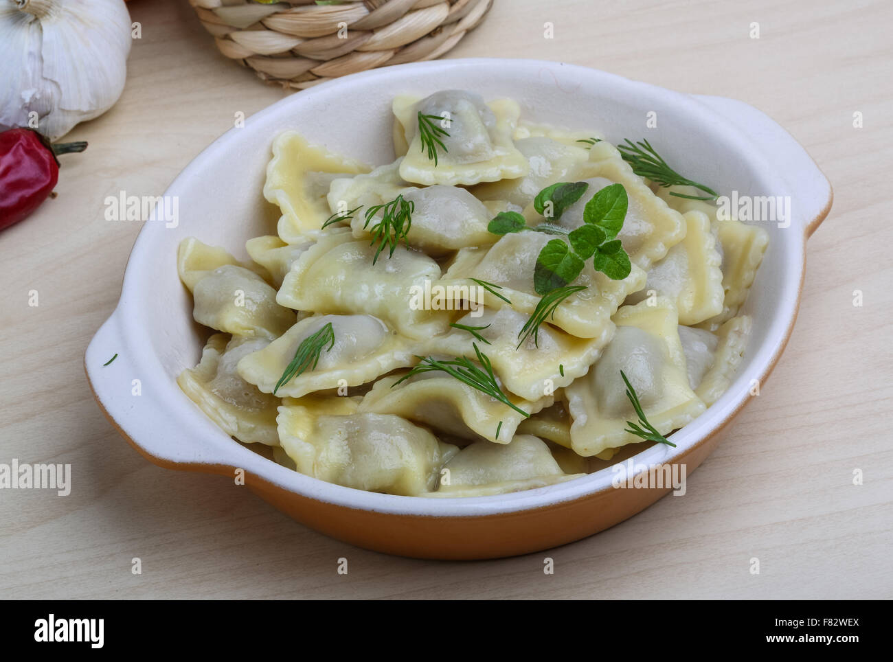 Italian dumplings Ravioli with fresh herbs and spices Stock Photo - Alamy
