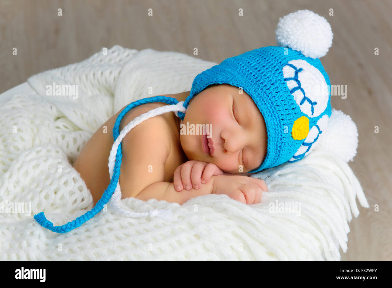 Sleeping smiling newborn baby Stock Photo - Alamy