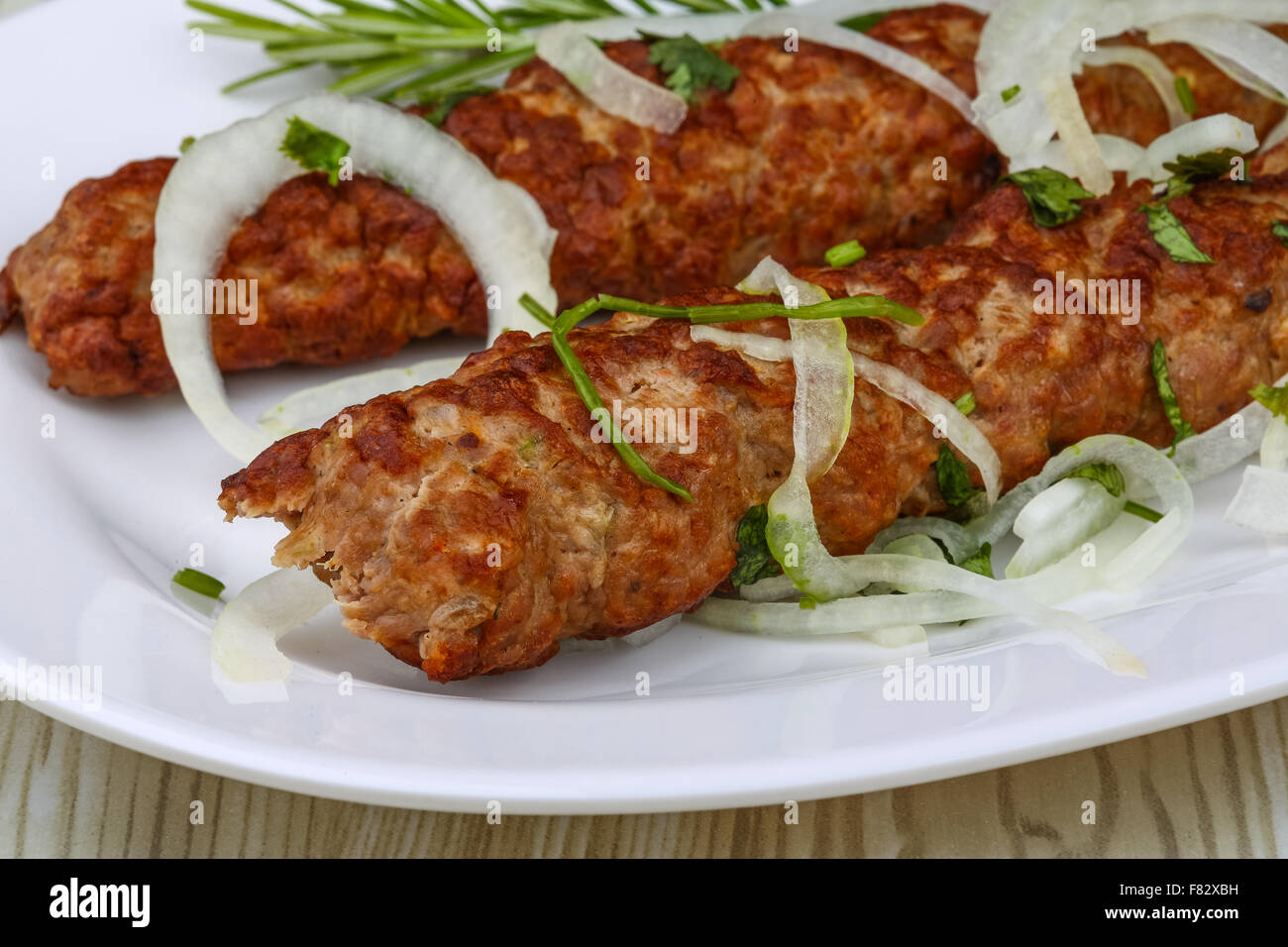 Hot Beef kebab with onion rings and rosemary Stock Photo - Alamy