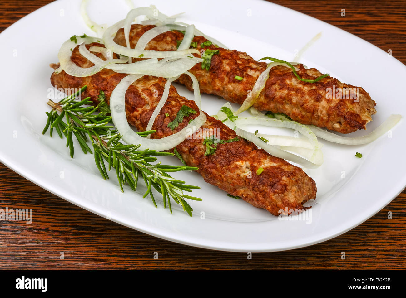Hot Beef kebab with onion rings and rosemary Stock Photo - Alamy