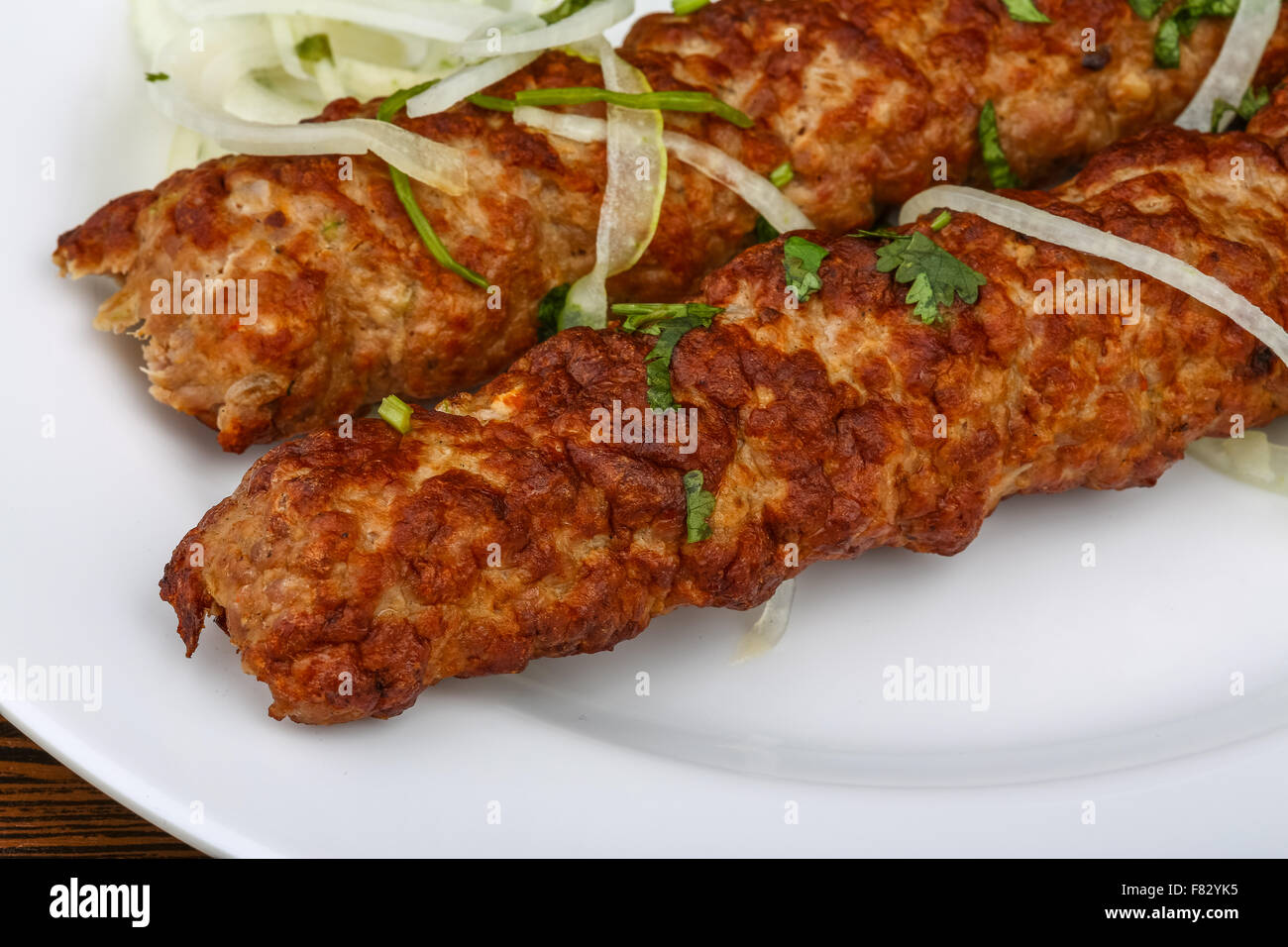 Hot Beef kebab with onion rings and rosemary Stock Photo - Alamy