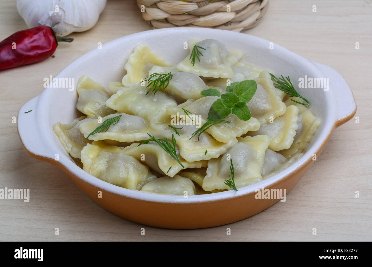 Italian dumplings Ravioli with fresh herbs and spices Stock Photo - Alamy