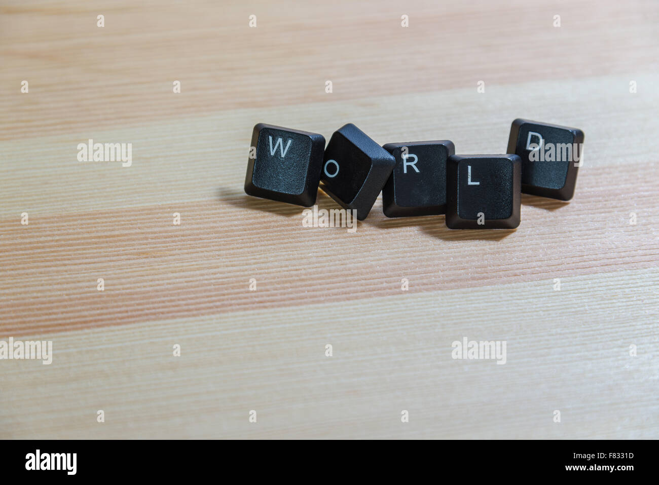 World word keyboard on wooden floor Stock Photo - Alamy