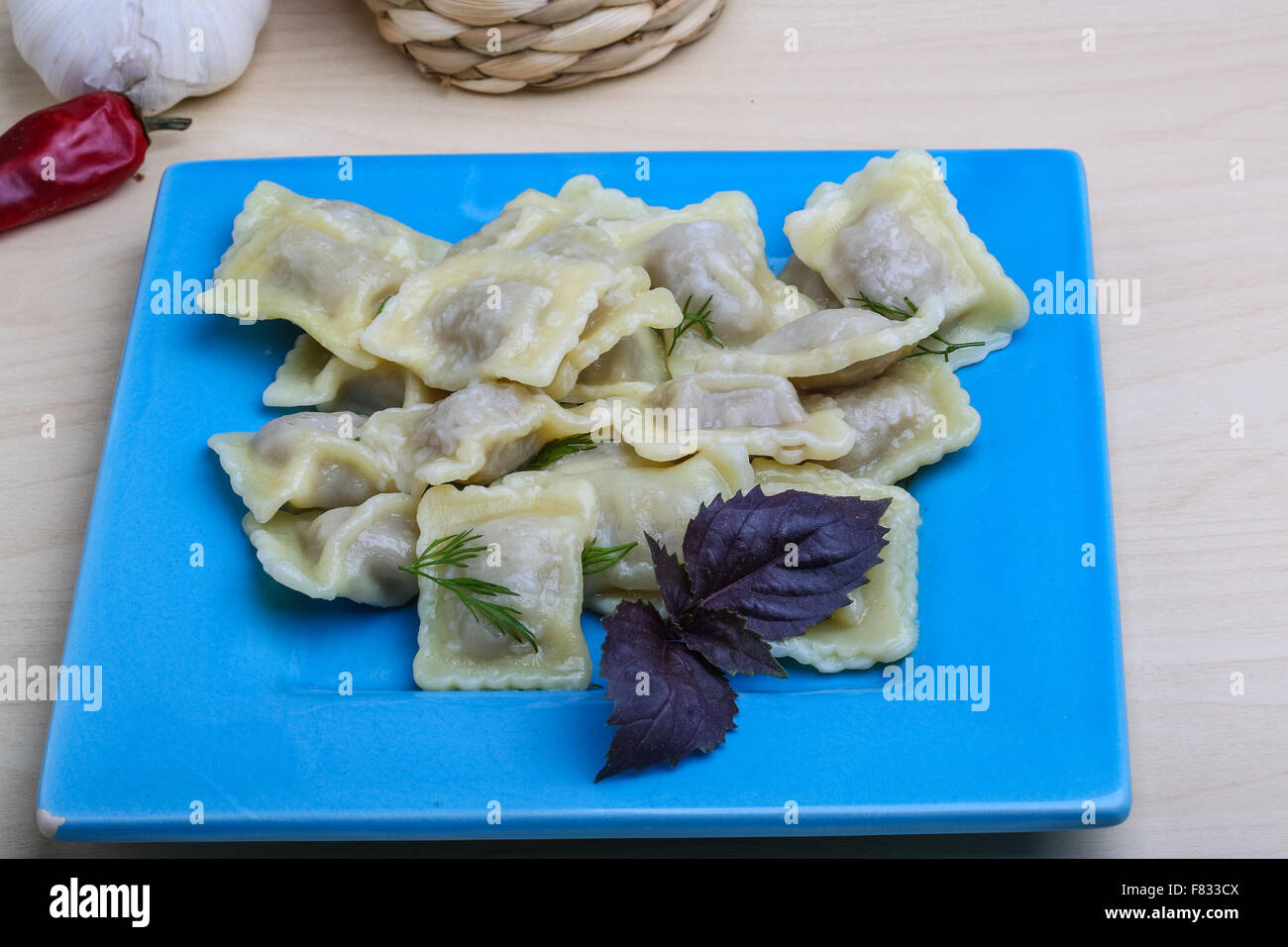 Italian dumplings Ravioli with fresh herbs and spices Stock Photo - Alamy