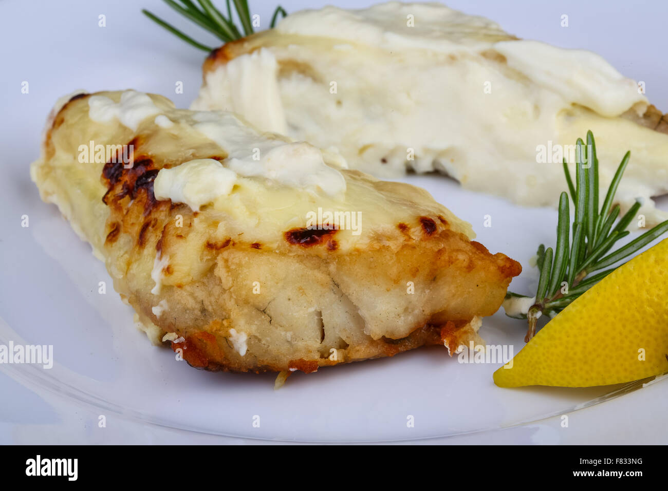 Baked perch fillet with rosemary and lemon Stock Photo - Alamy