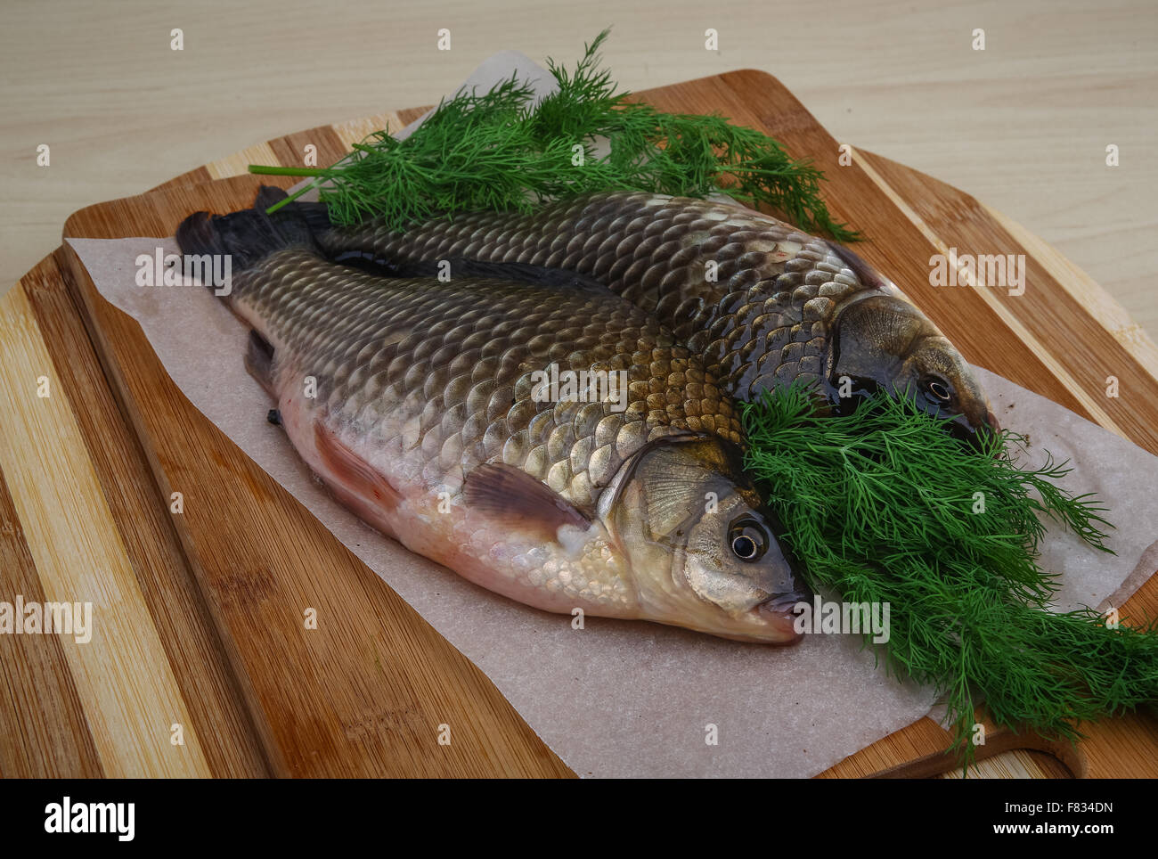Two crucian with dill ready for cooking Stock Photo - Alamy