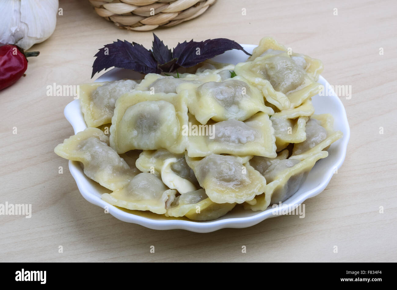 Italian dumplings Ravioli with fresh herbs and spices Stock Photo - Alamy